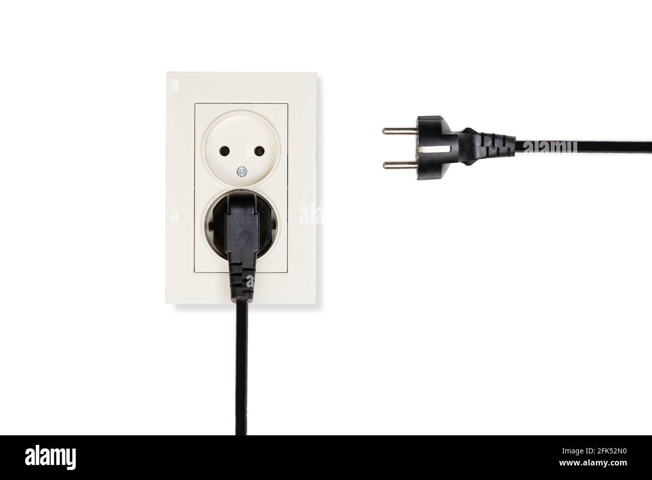 Closeup beige double electrical outlet and two black cables with plugs ...