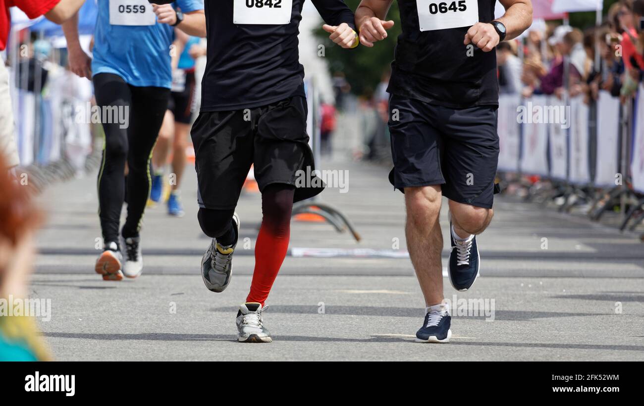 Marathon running race. Athletes runners run on a sports track Stock ...
