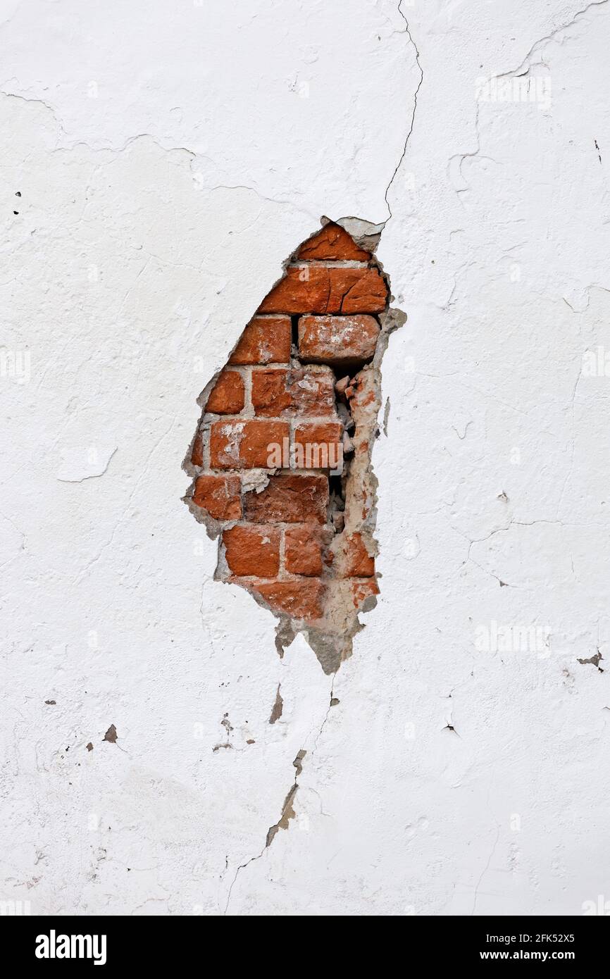 Brick through plaster hi-res stock photography and images - Alamy
