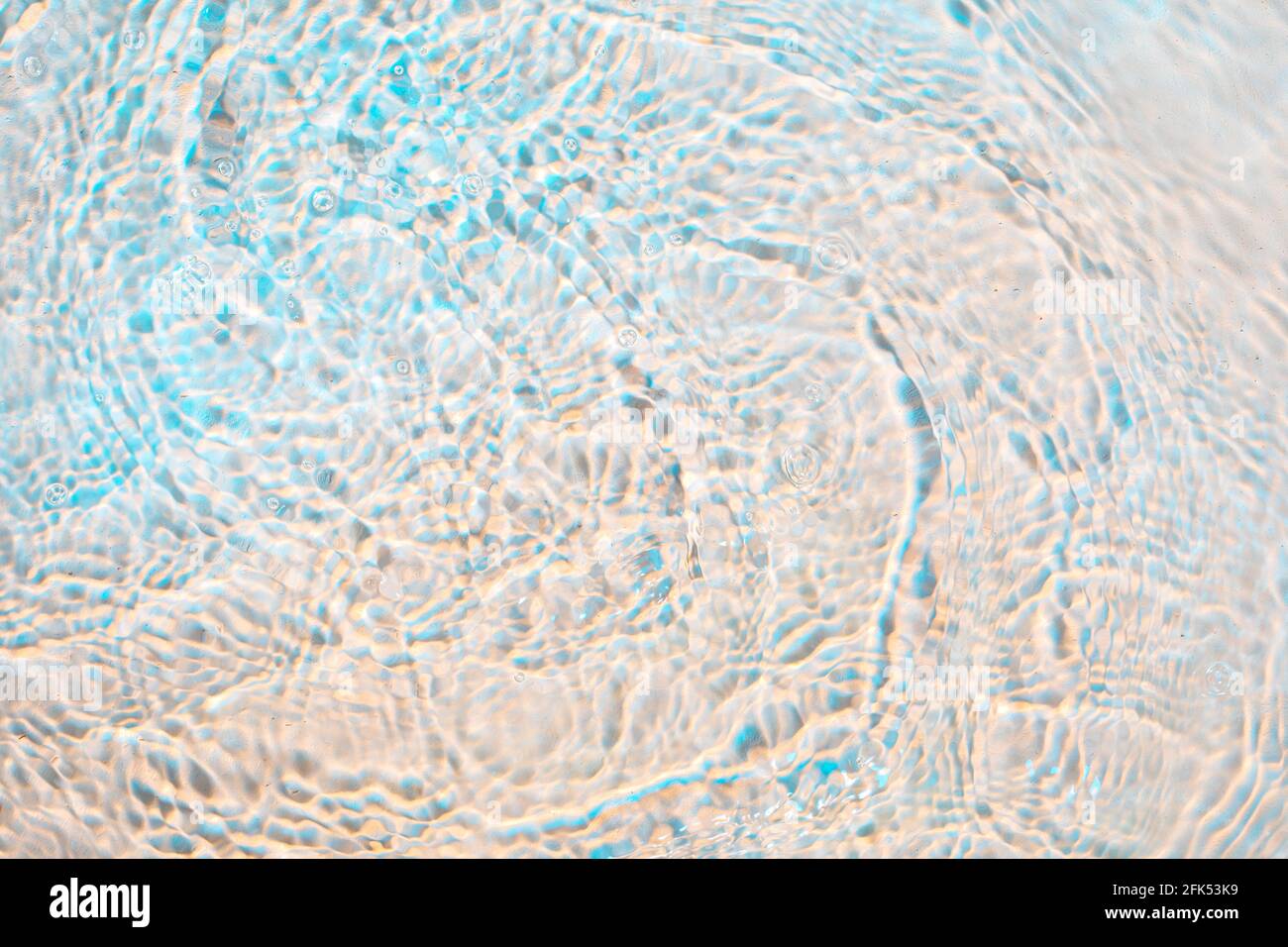 Light wavy with rainbow colors abstract rippled water texture ...