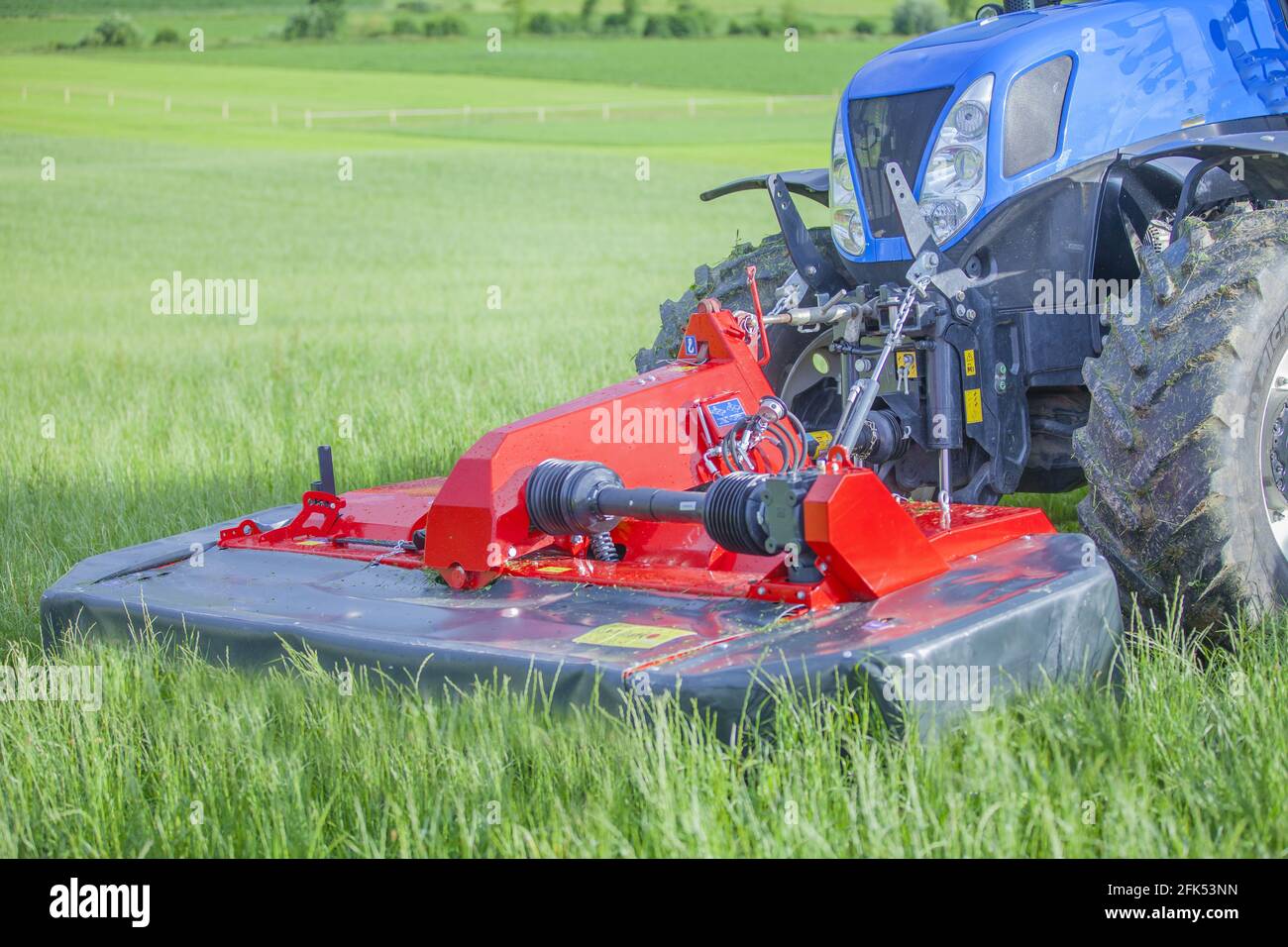 Mower sip in an agricultural field Stock Photo - Alamy