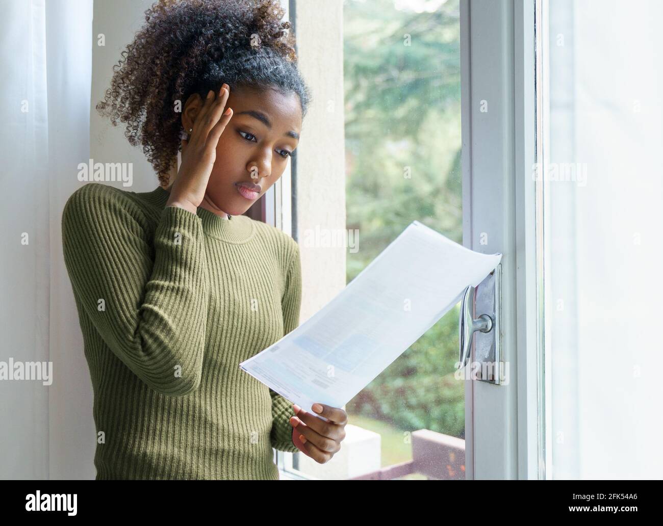African Woman Reading Letter High Resolution Stock Photography and ...