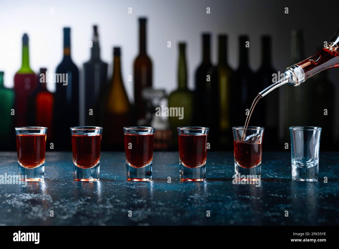 Shots of strong alcohol on a table in the bar Stock Photo - Alamy