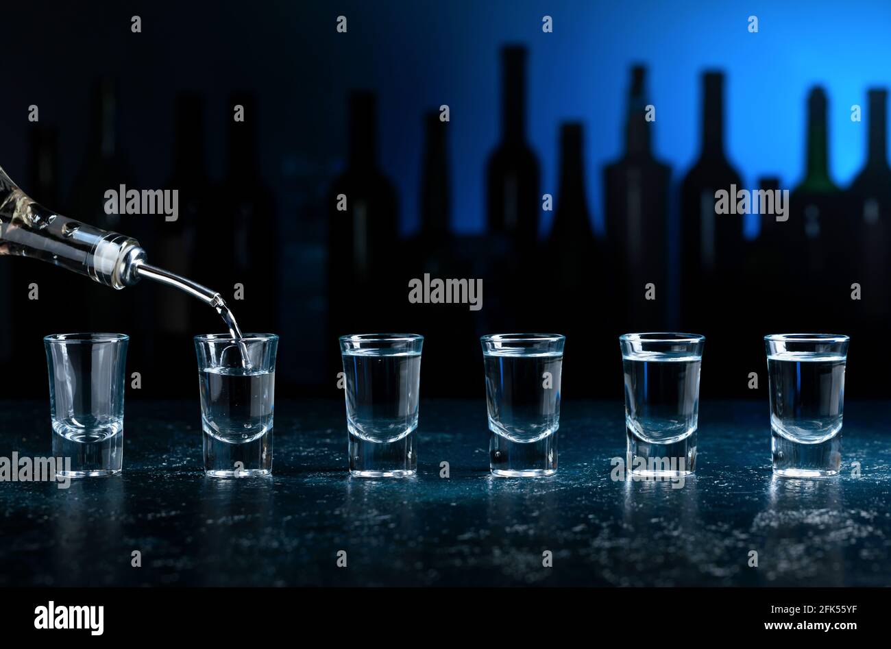 Shots of strong alcohol on a table in the bar Stock Photo - Alamy