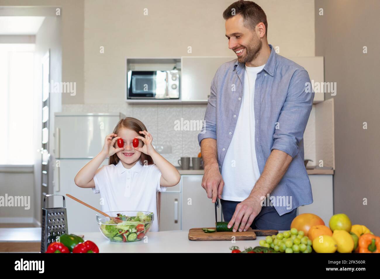 Dad And Daughter Having Fun Cooking Together In Modern Kitchen Stock ...