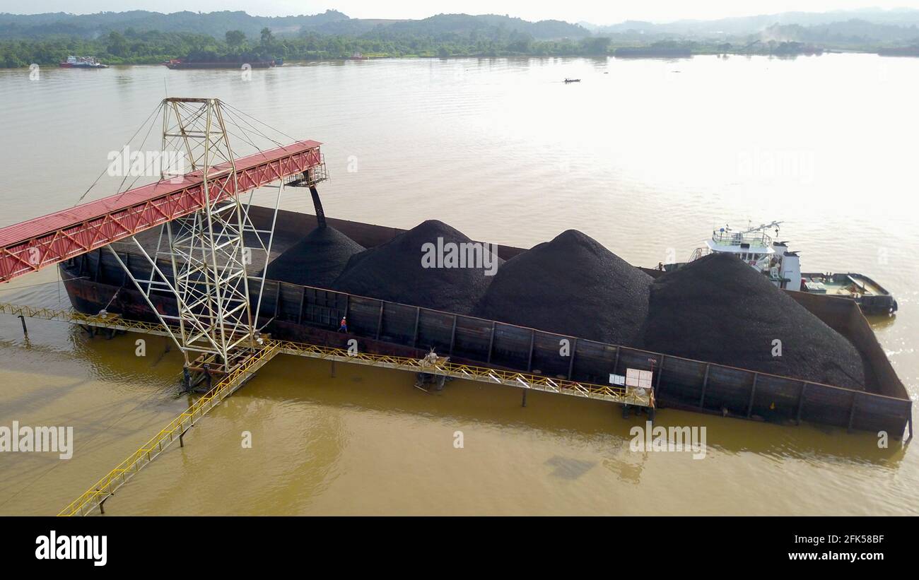 Coal Shipping in indonesia, loading the coal onto the barge aerial view ...
