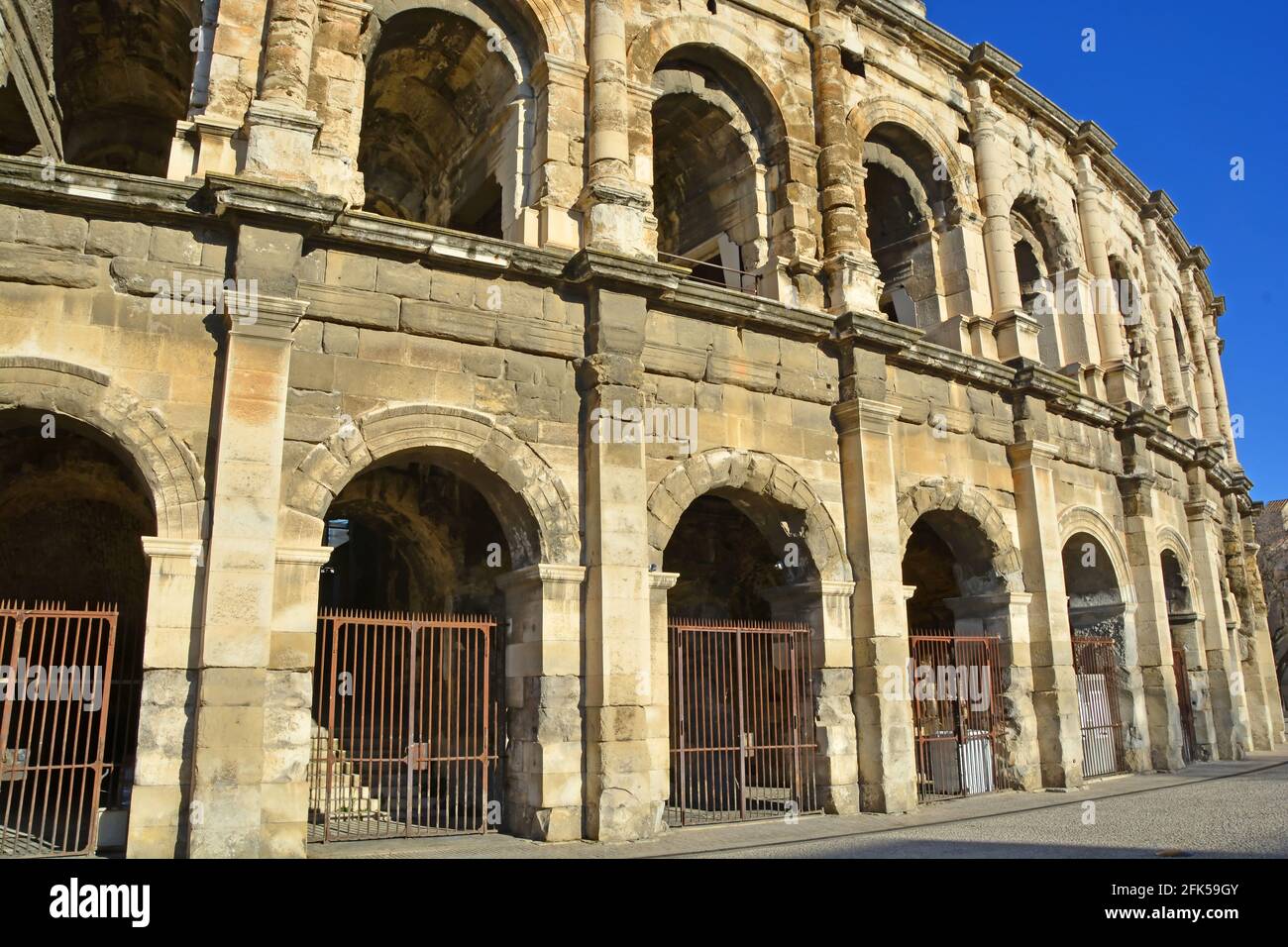 Arches in the outer wall of the Ancient Roman Amphitheatre at Nimes in ...