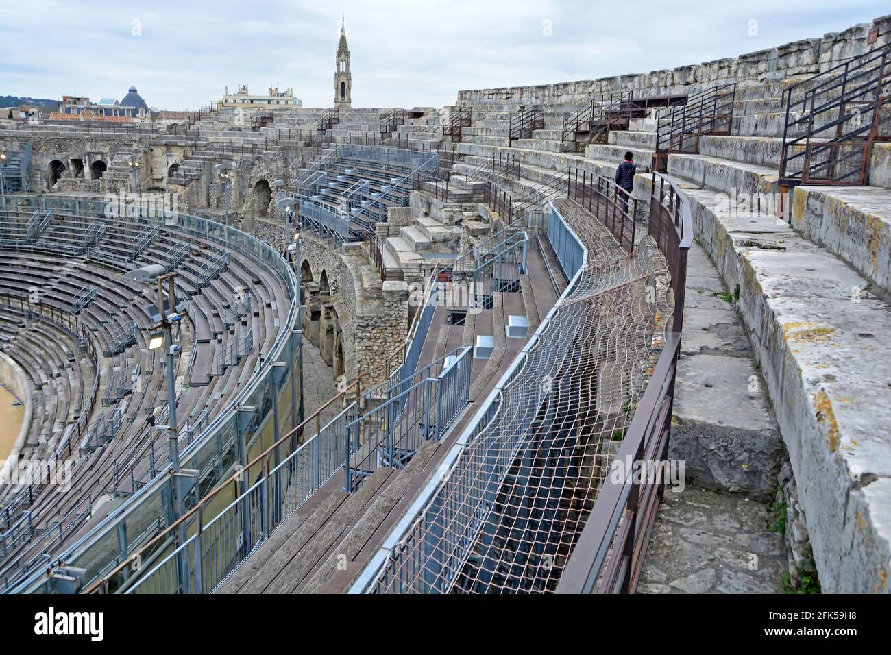 Rows of seats in an ancient Roman Amphitheatre at Nimes in the South of ...
