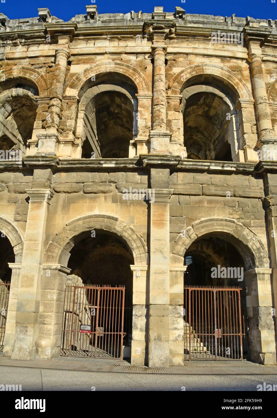 Arches in the outer wall of the Ancient Roman Amphitheatre at Nimes in ...