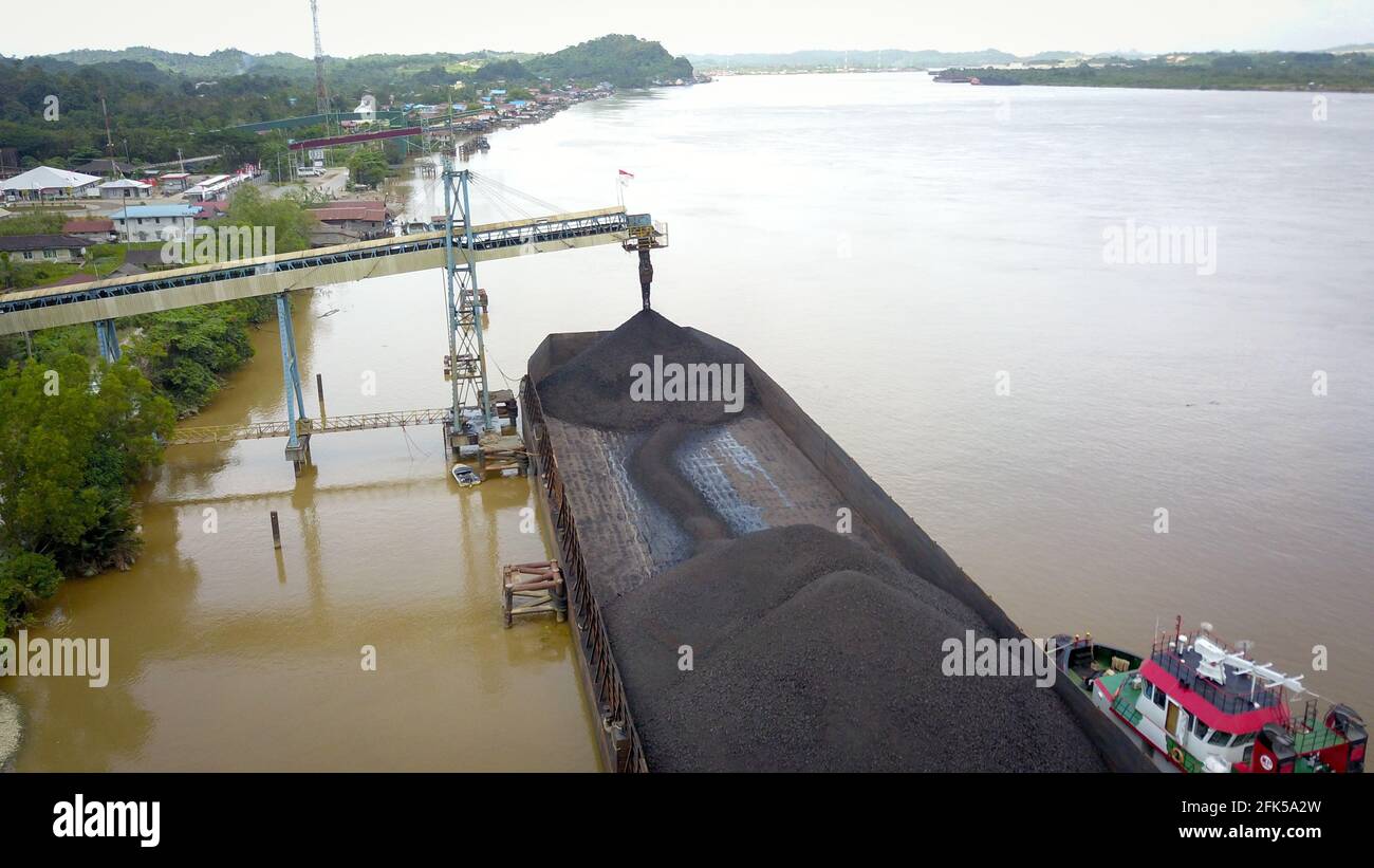 Coal Shipping in indonesia, loading the coal onto the barge aerial view ...