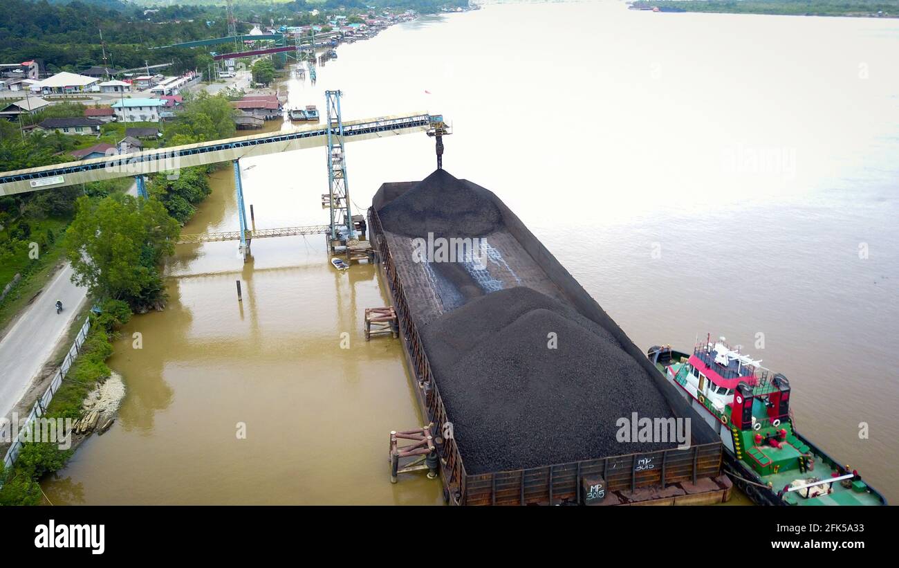 Coal Shipping in indonesia, loading the coal onto the barge aerial view ...