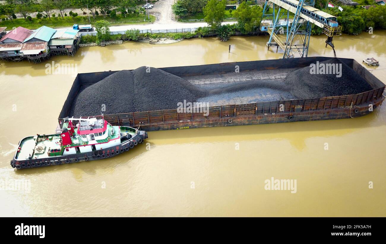 Coal Shipping in indonesia, loading the coal onto the barge aerial view ...