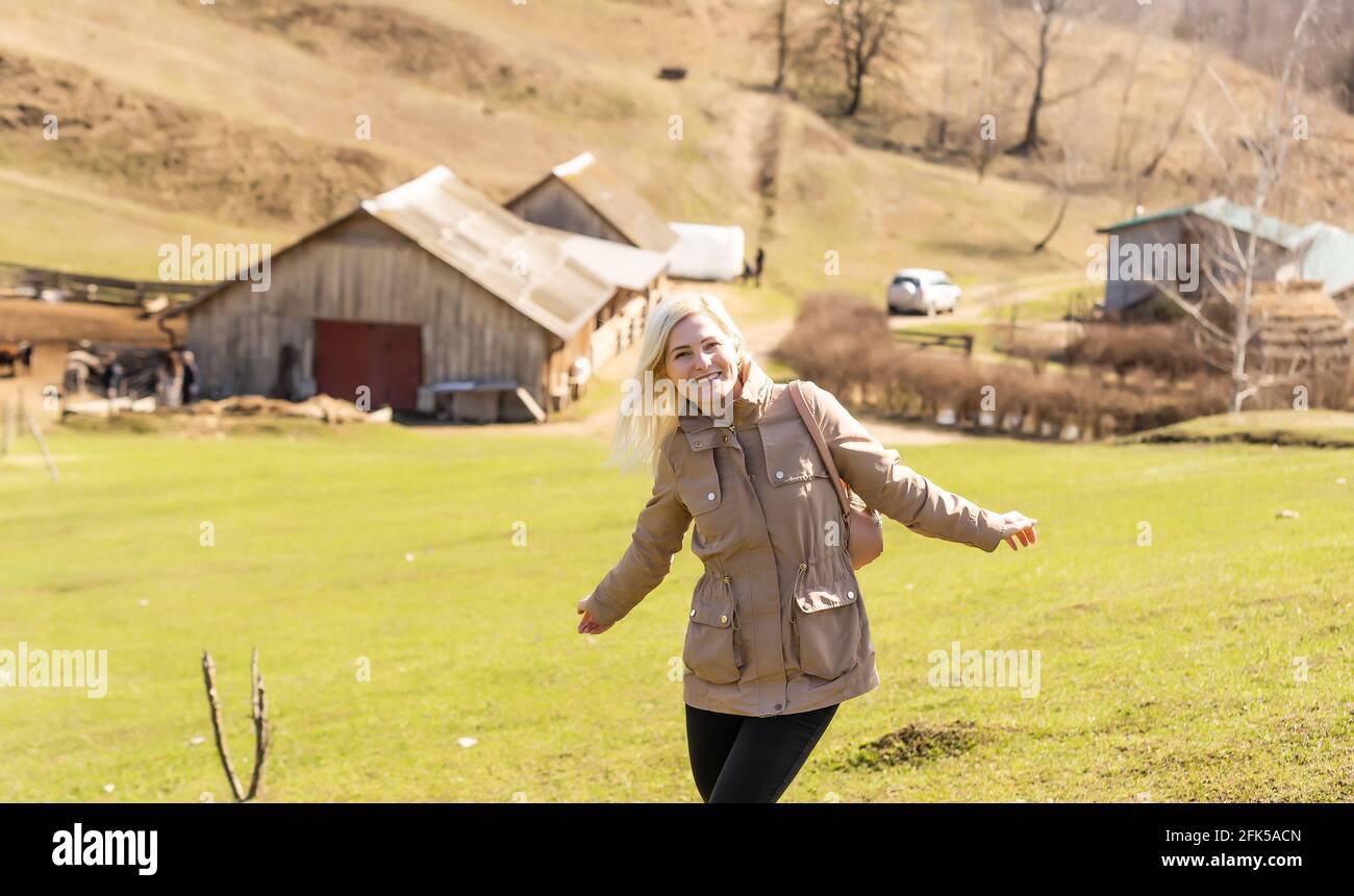 Countryside landscape, farm field and grass with grazing cows on ...