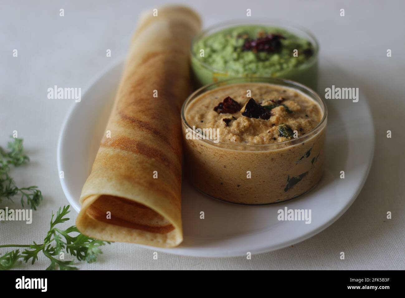 Crispy pancake made of fermented foxtail millet batter. Served with a ...