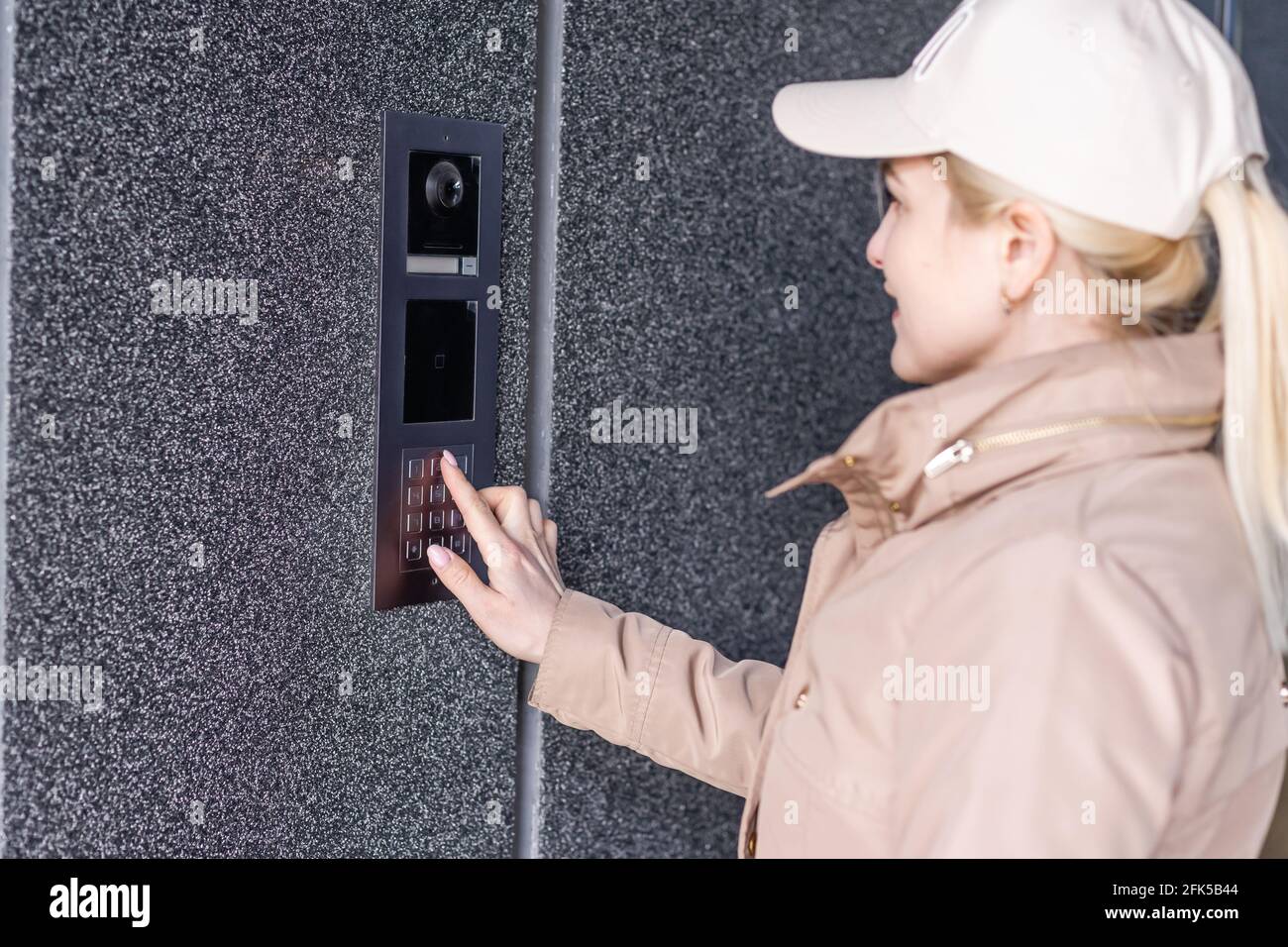 Woman young intercom system hi-res stock photography and images - Alamy