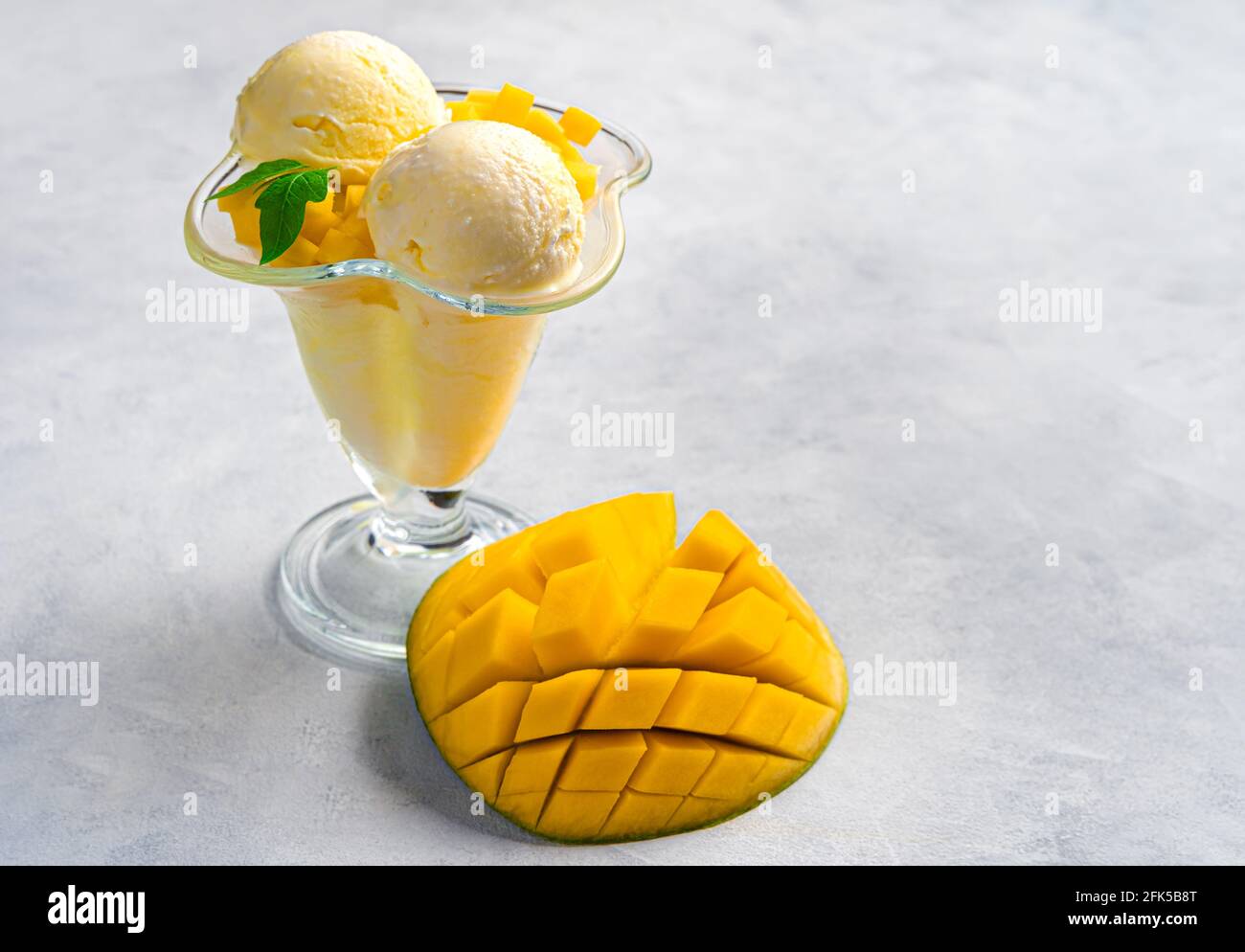 Mango ice cream and fresh fruit, side view with copy space Stock Photo ...