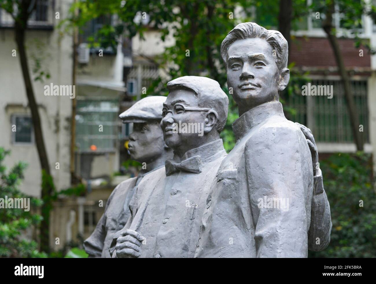 Statues of three famous residents of Guangzhou, in a residential area ...