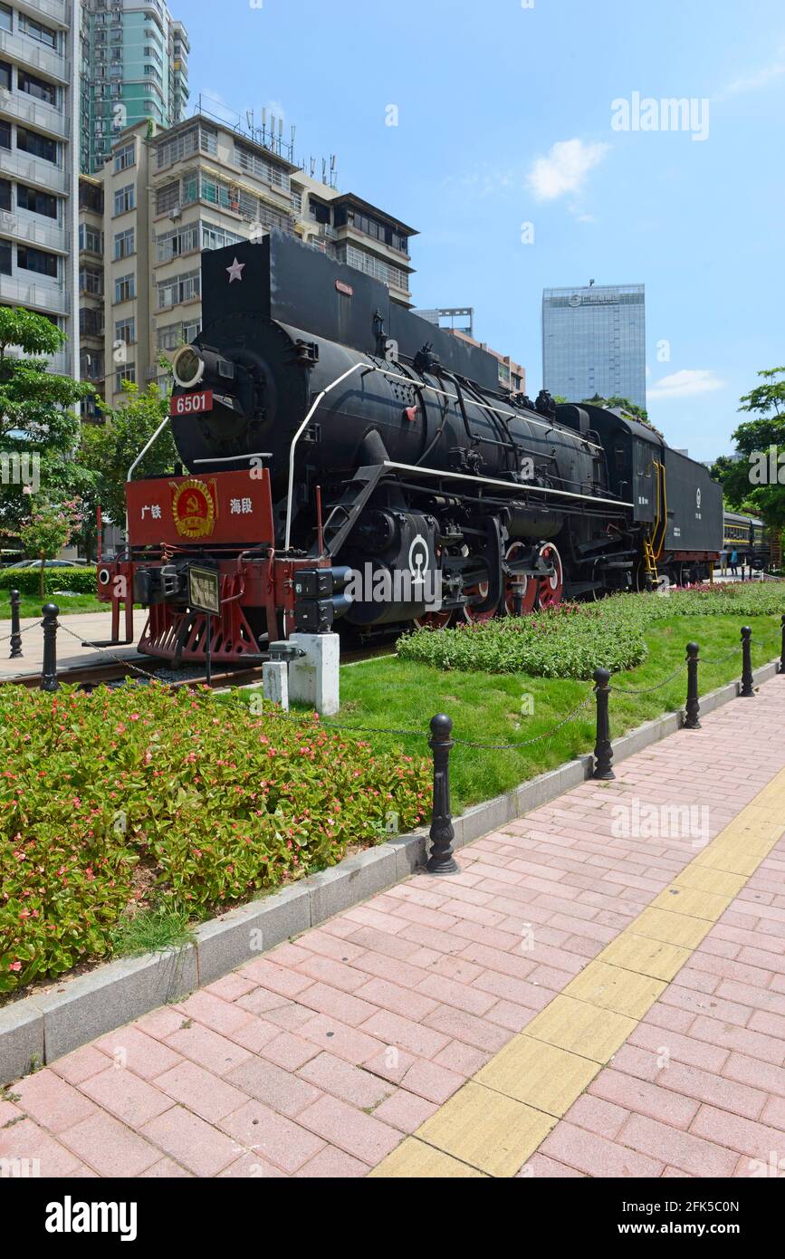 An old steam locomotive is plinthed in a residential district of ...