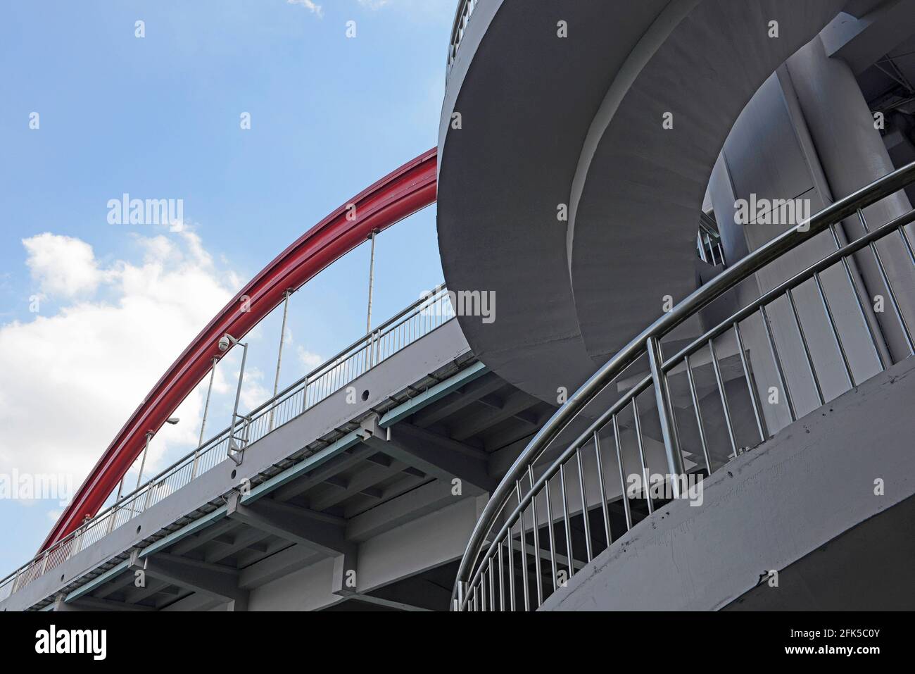 The curves of a pedestrian access ramp are echoed in the beams of ...