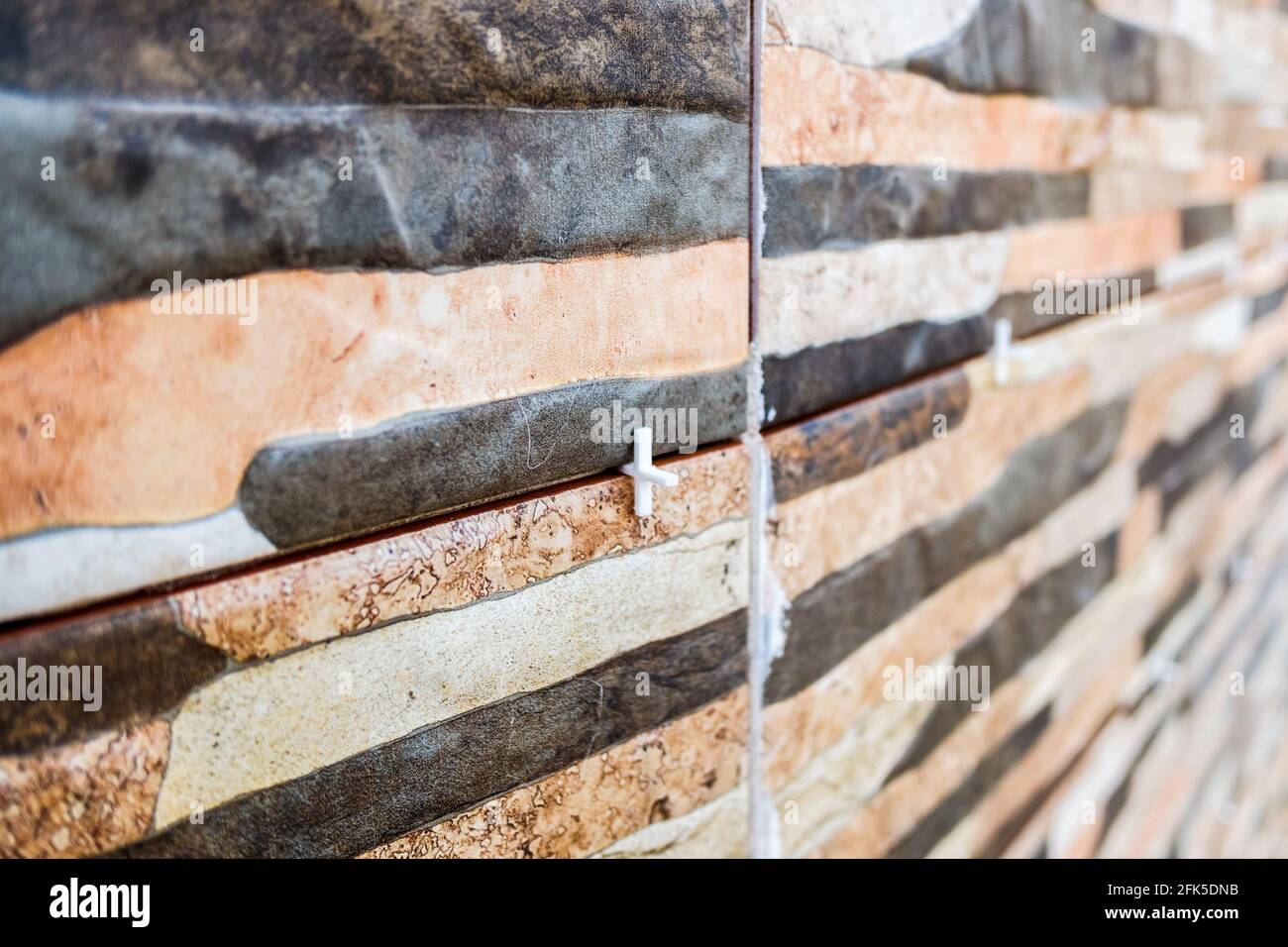 Tile spacers, plastic pieces to separate tiles during installation ...