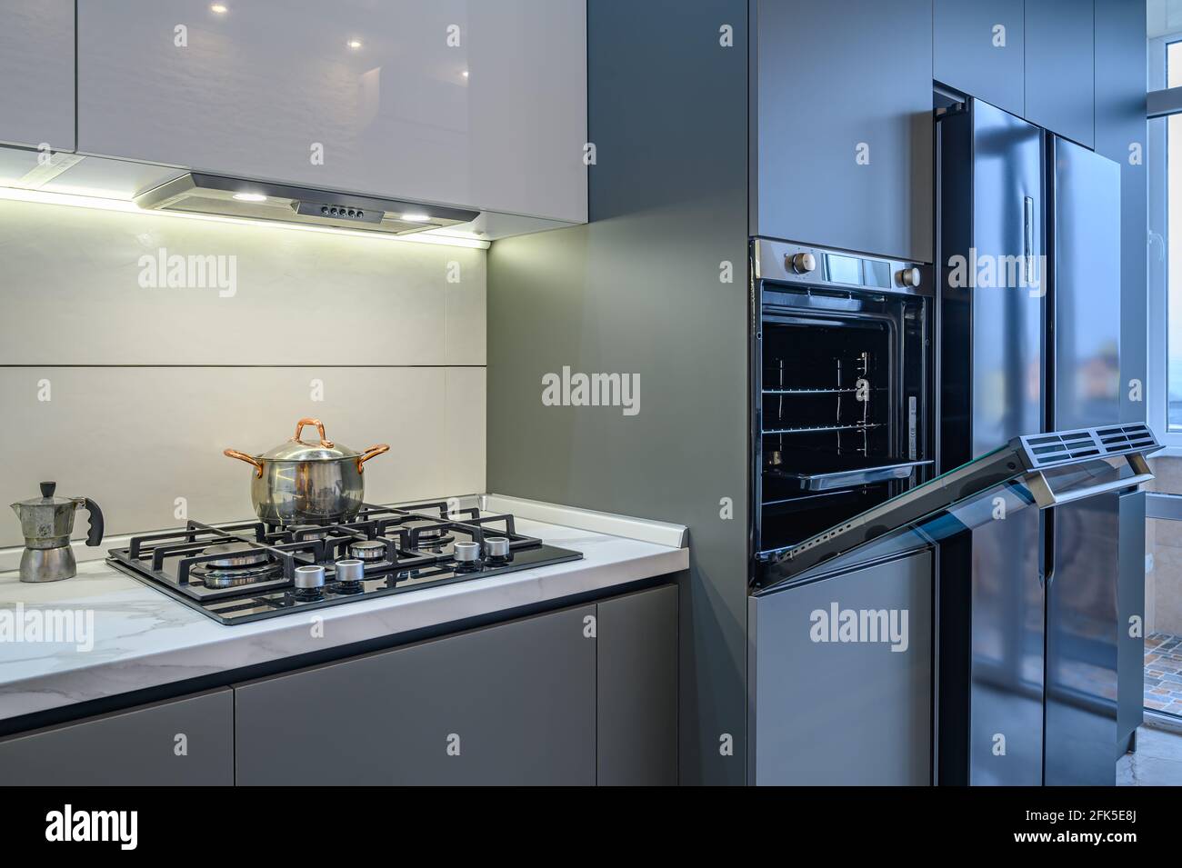 Luxury modern kitchen interior, oven's door opened Stock Photo - Alamy