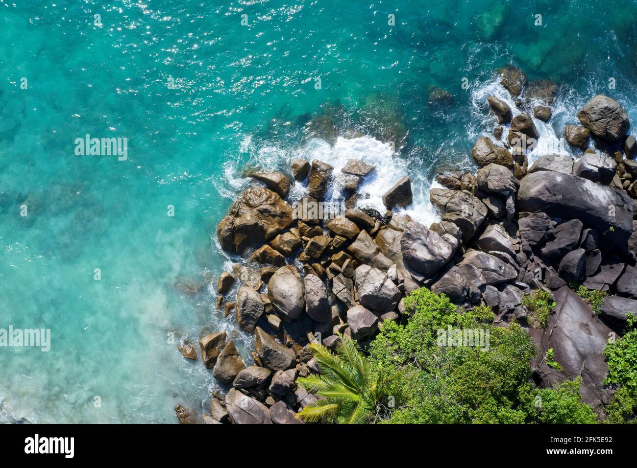 Drone field of view of turquoise water and beautiful rocks meeting sea ...