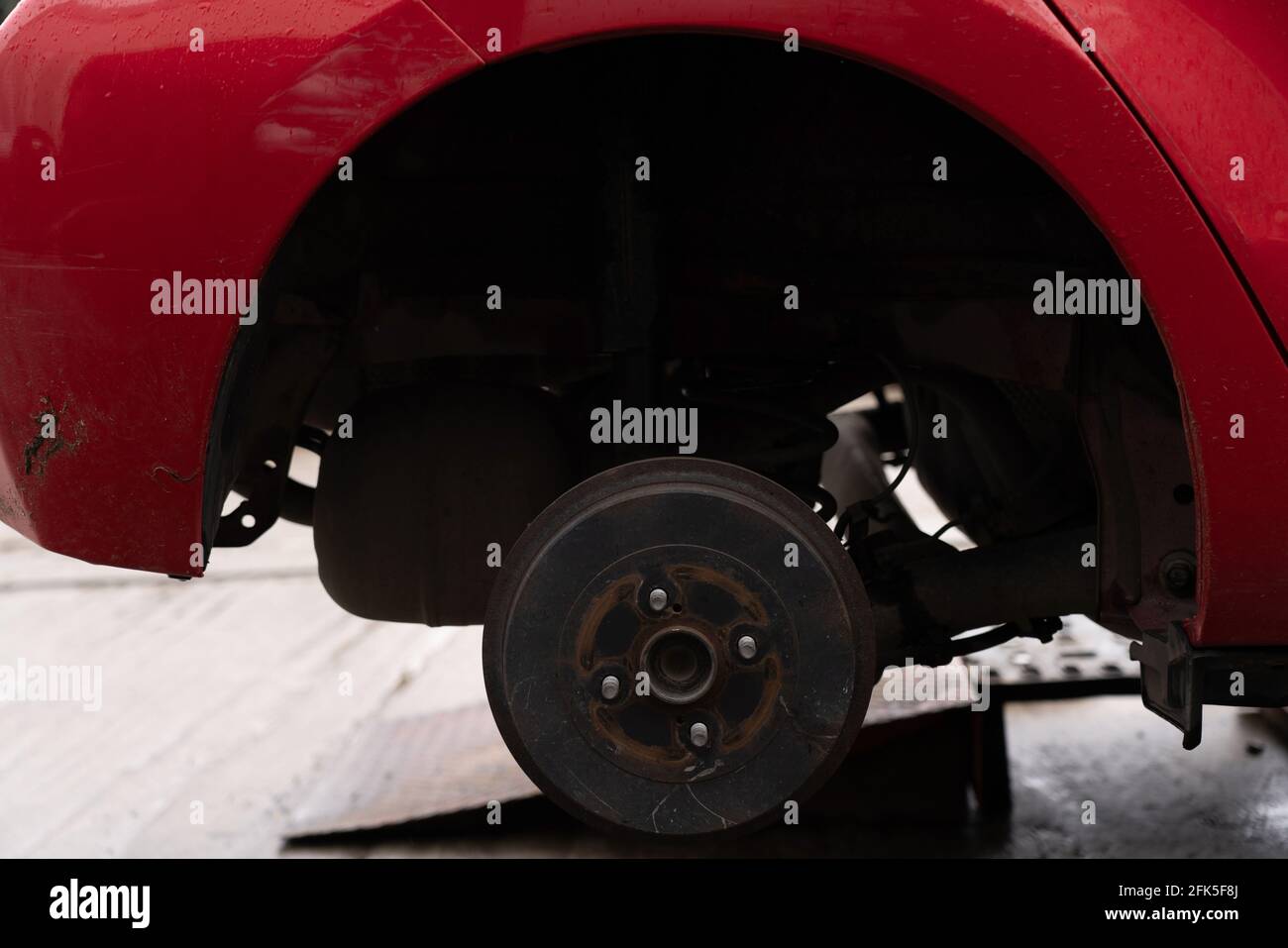 red car being repaired dismantled wheel Stock Photo - Alamy