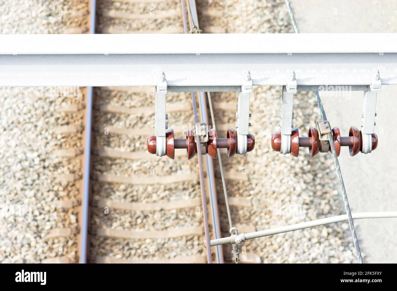 Closeup of the catenary of the railway Stock Photo - Alamy