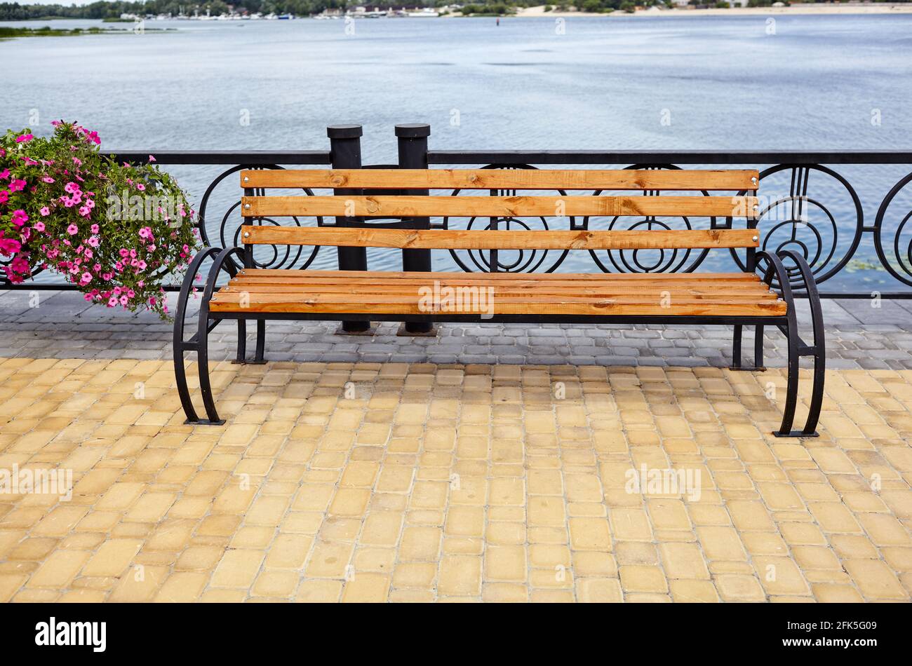 Embankment with bench with view on sea. Park wooden bench on the ...