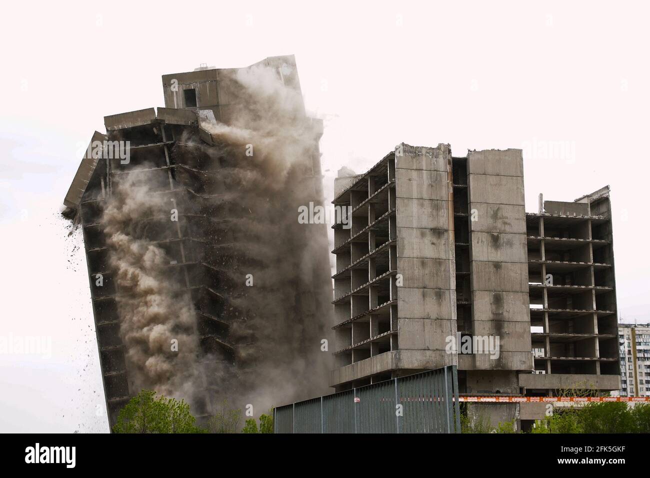 Old building demolition by controlled implosion using explosives Stock ...