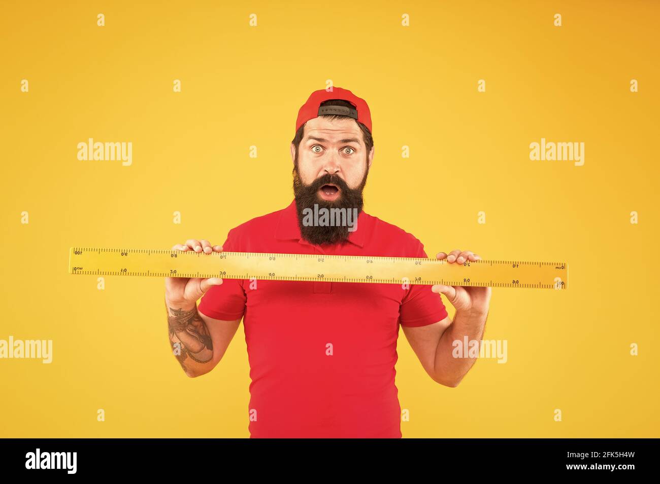 Without geometry life is pointless. Surprised hipster hold ruler yellow ...