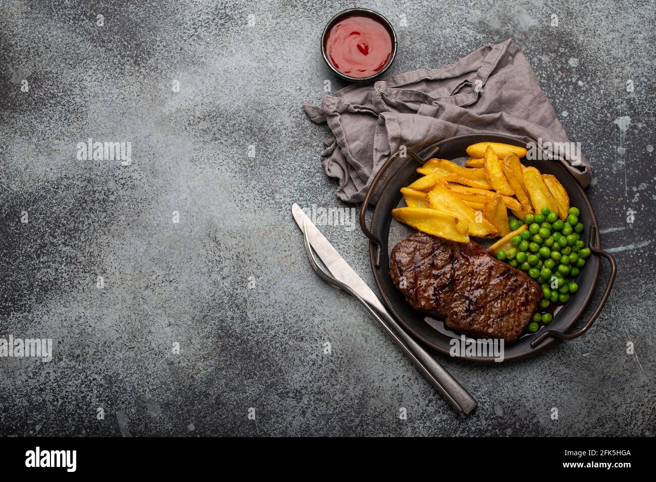 Grilled meat steak with potato chips and salad sirloinfrom above copy ...