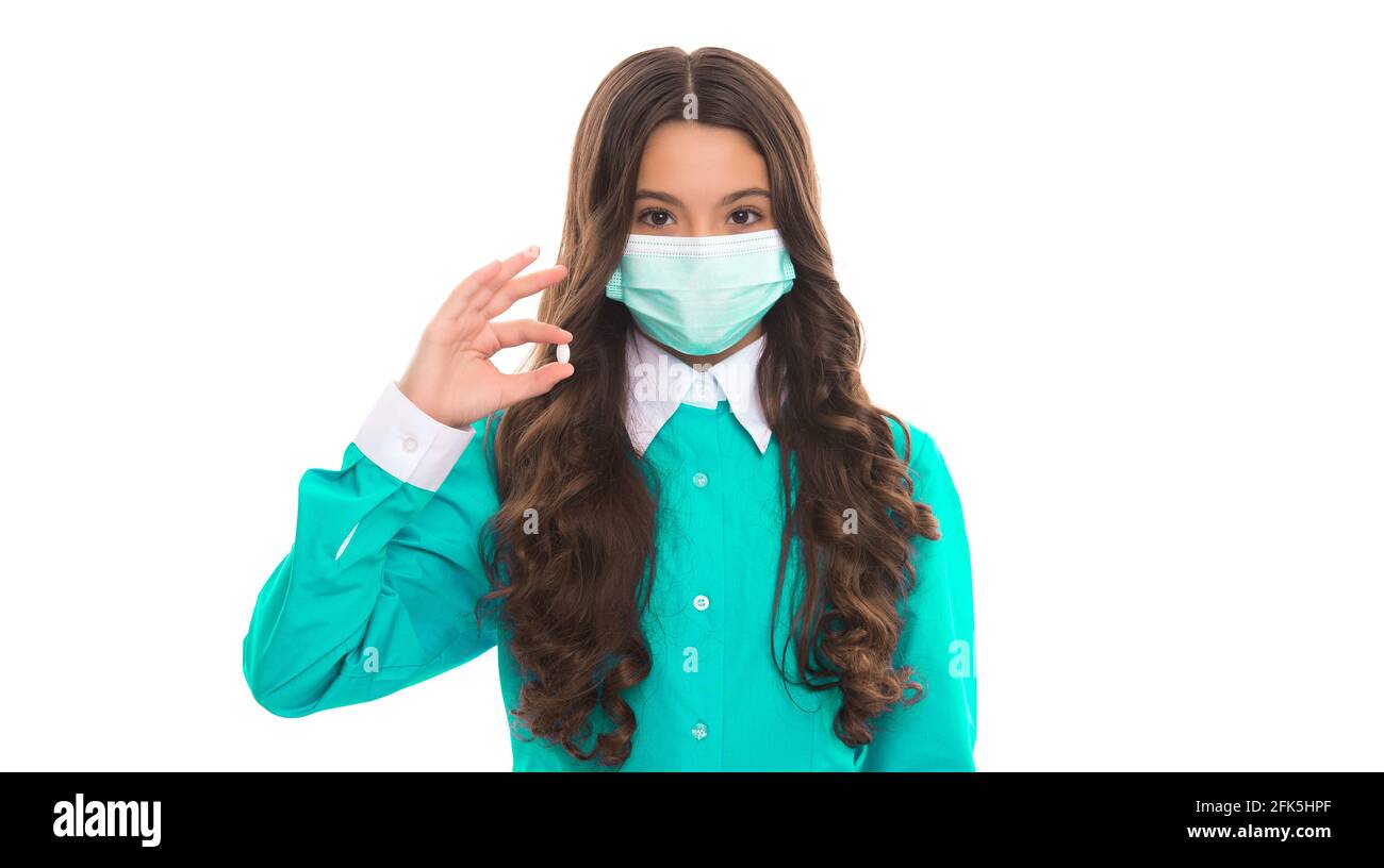 girl hold vitamins or medicine drug pills from fever wearing protective ...