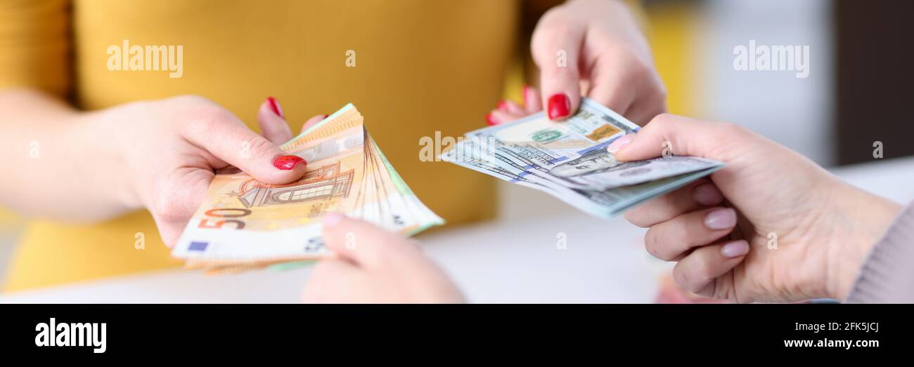 Transfer of currency from hand to hand at workplace Stock Photo - Alamy