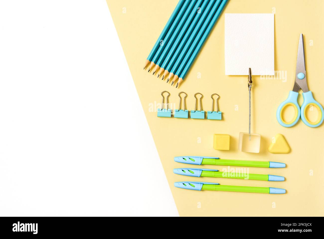 school tools on blue and yellow background. top view knolling.back to ...