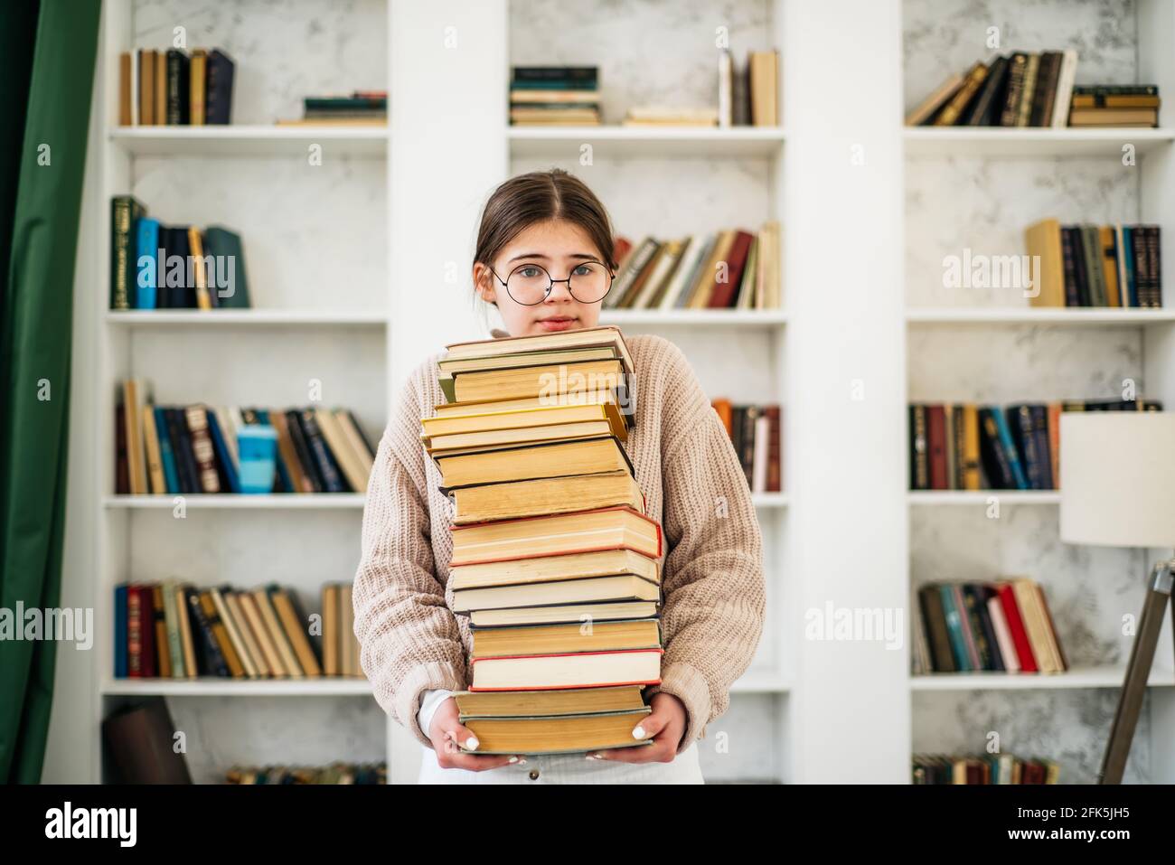 in library Student girl studying hard Stock Photo - Alamy