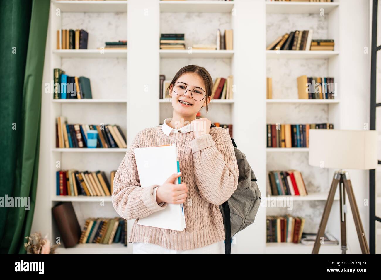 in library Student girl studying hard Stock Photo - Alamy