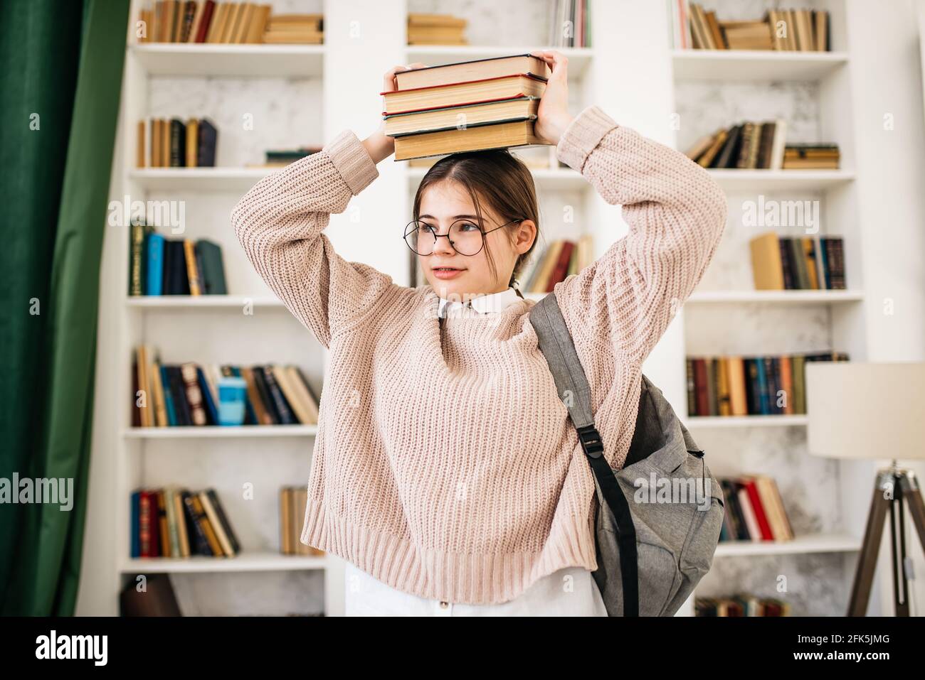 in library Student girl studying hard Stock Photo - Alamy