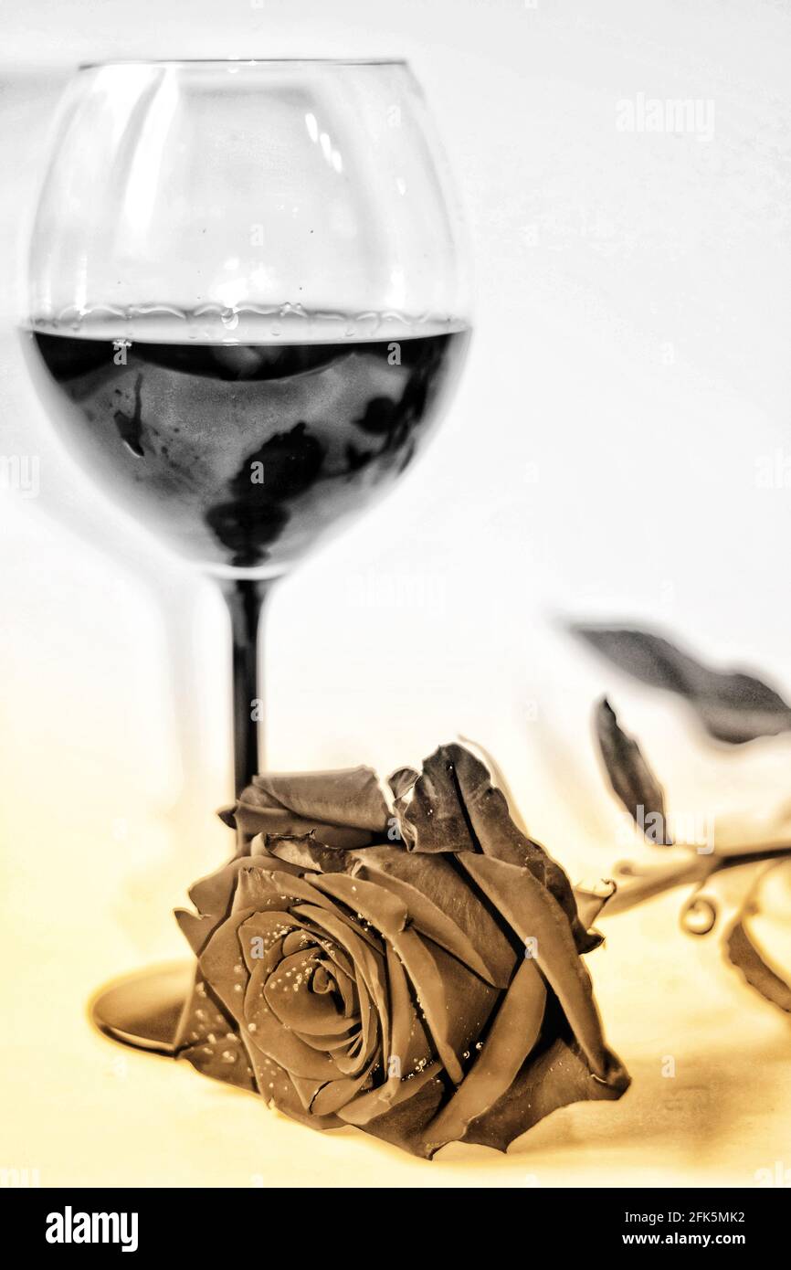 Beautiful red rose and glass of red wine. Can be use for greeting cards ...