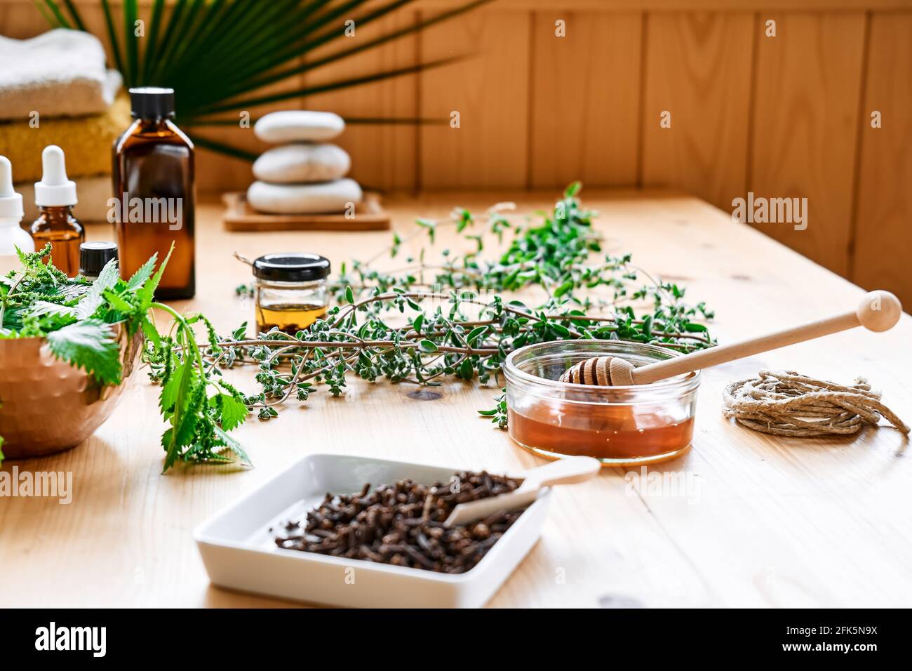 Medical herbs, different types of oils and essences on the table ...