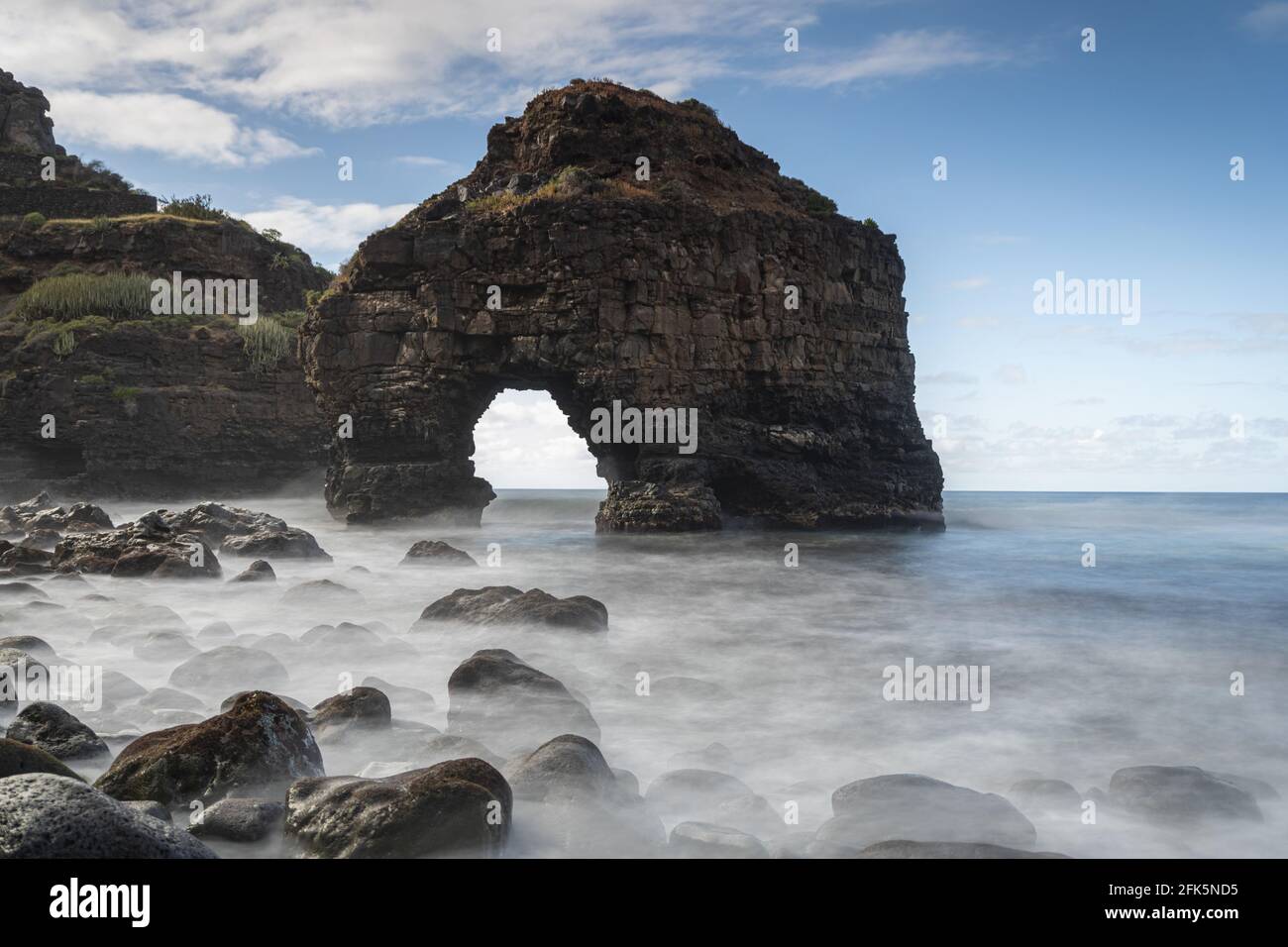 Beautiful shot of a rock formation in the middle of the boundless sea ...