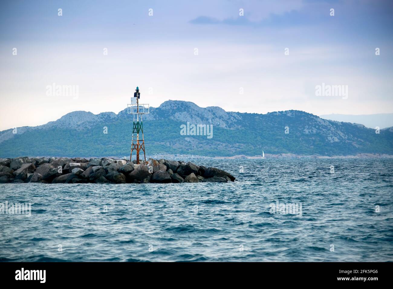 Rusty light tower on the sea Stock Photo - Alamy