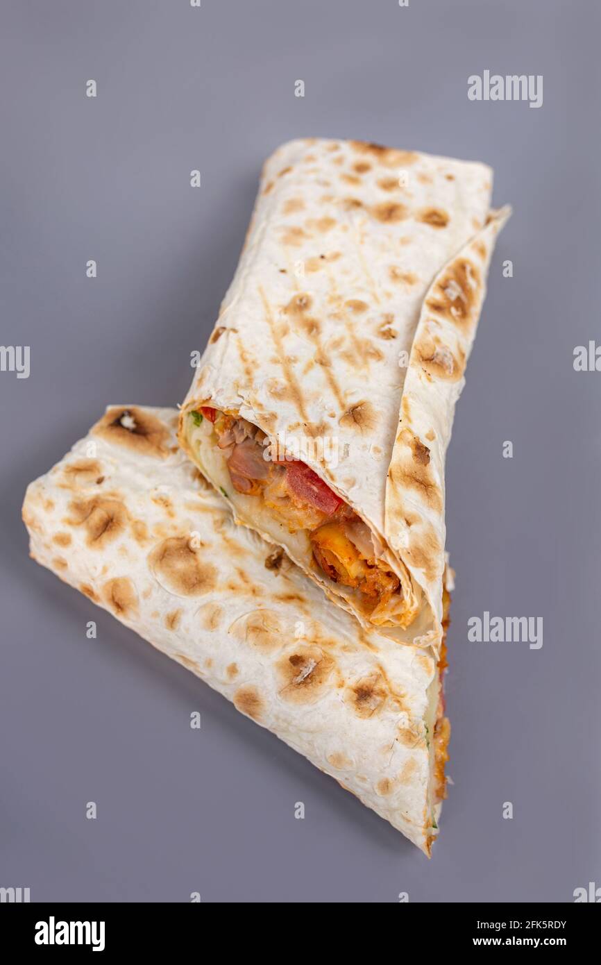 View from top of the doner with meat and vegetable filling on a gray ...