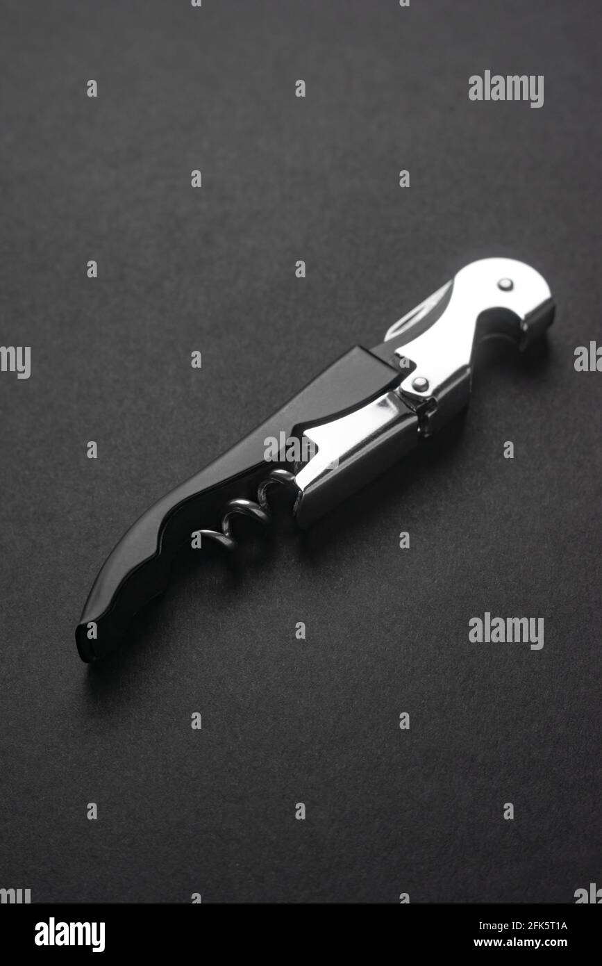 Opened sommelier knife with corkscrew and bottle opener, professional ...