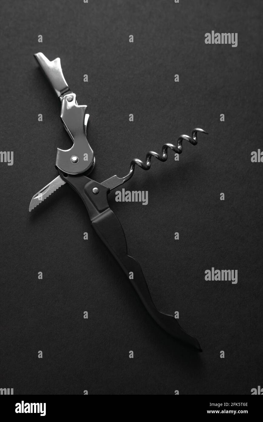Opened sommelier knife with corkscrew and bottle opener, professional ...
