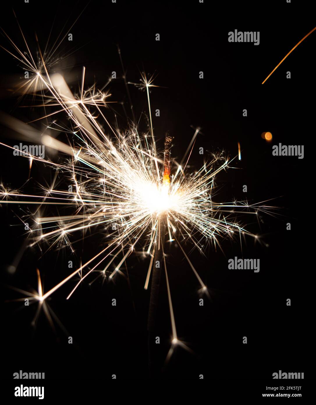 Sparkling bengal firework on black background Stock Photo - Alamy