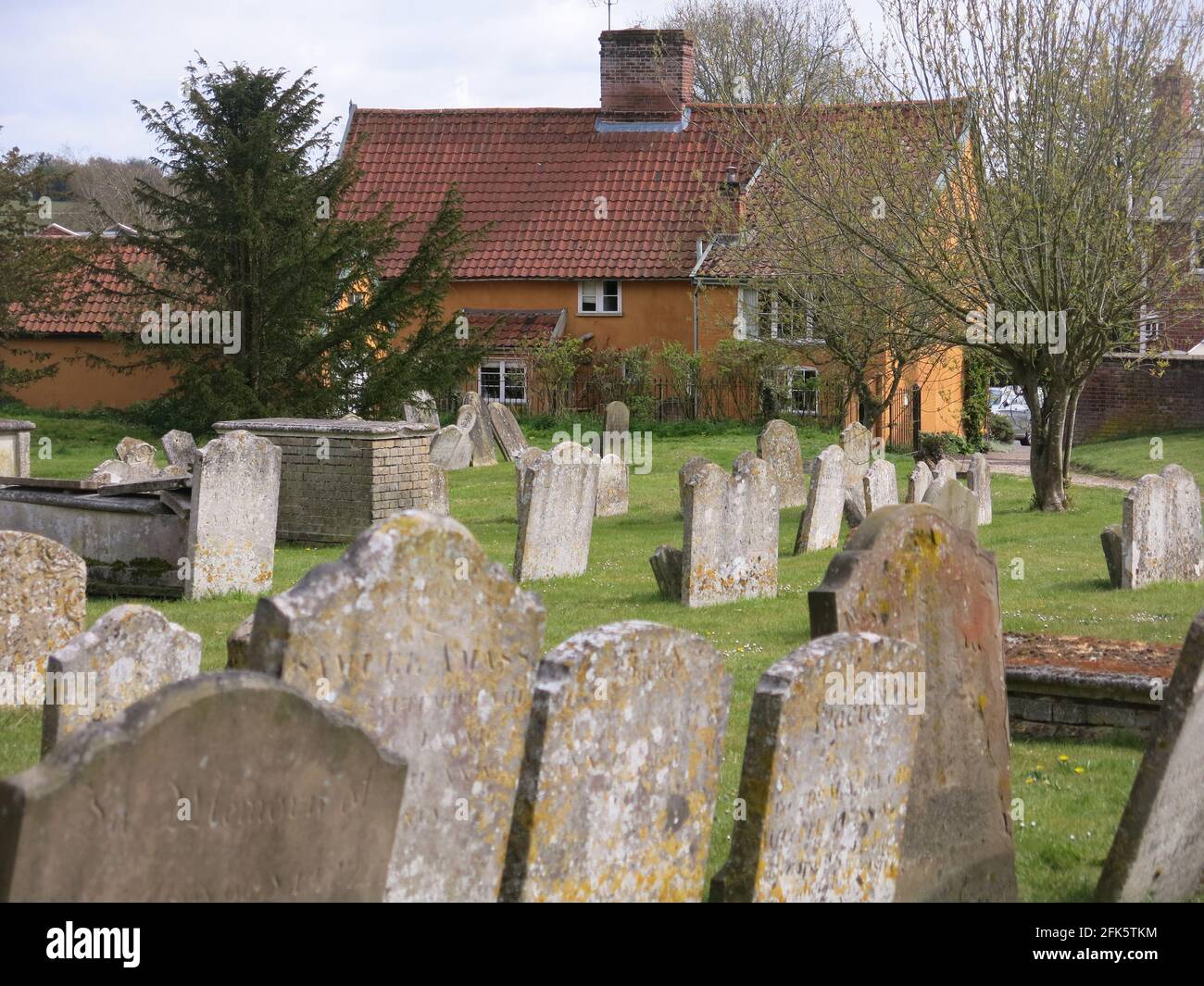 View across the churchyard and all the gravestones at the Church of St ...