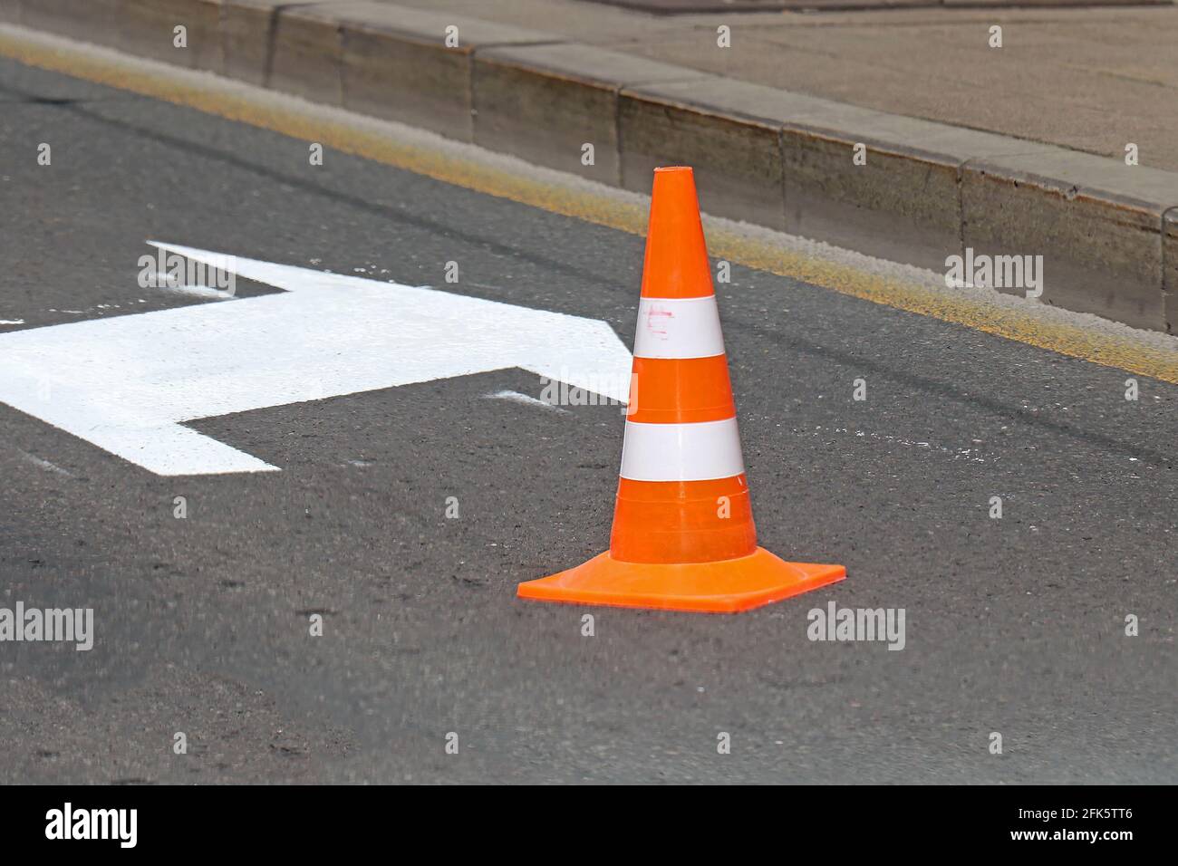 Plastic traffic cone isolating the street during road works Stock Photo ...