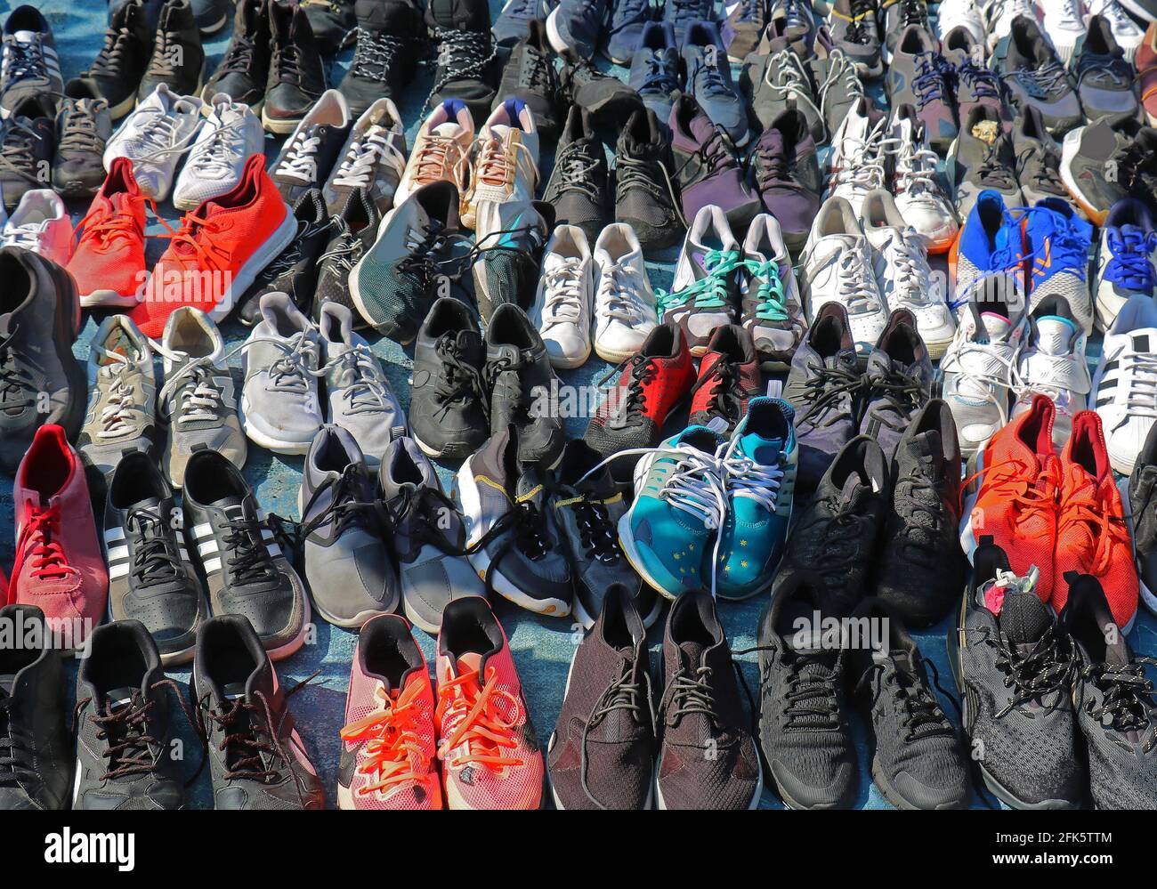 Large pile of sports sneakers sold on market Stock Photo - Alamy