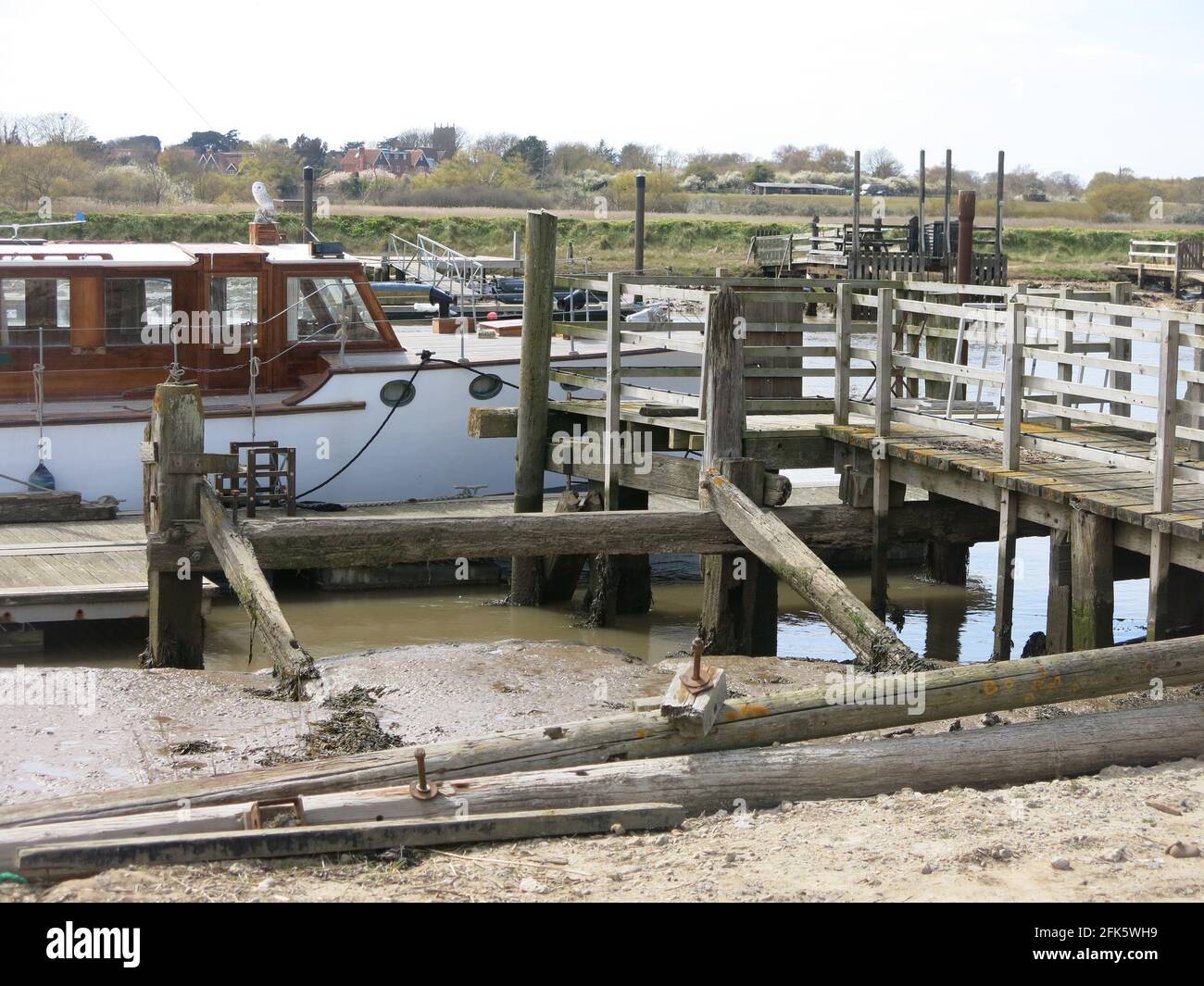 Wooden landing stages and fishing boats: a typical scene of the Suffolk ...